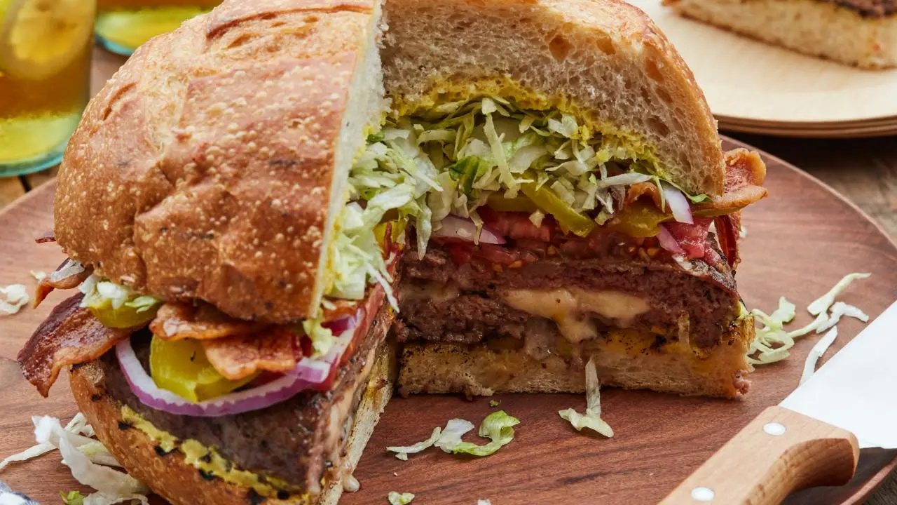 Giant Bacon-Cheddar Juicy Lucy Burger Recipe | Roger Mooking | Food Network